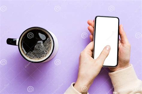 Top View Of Woman Hands Holding Smart Phone With Blank Copy Space