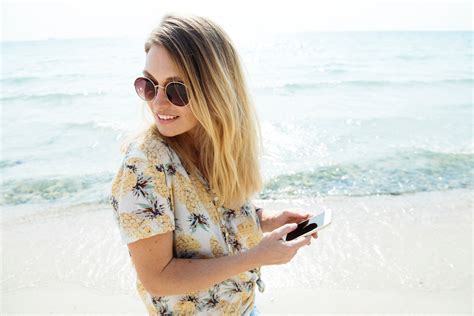 Free Photo Woman Wearing Sunglasses At The Beach Beach Sea Water
