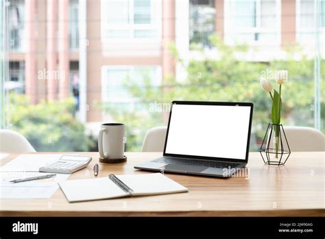 Modern Office Desk With Open Laptop Computer White Screen Mockup