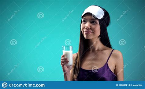 Asian Woman Holding Milk Glass Beverage For Better Sleeping Calcium
