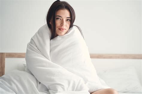 Premium Photo Portrait Of A Serene Pretty Woman Wrapped In A Duvet