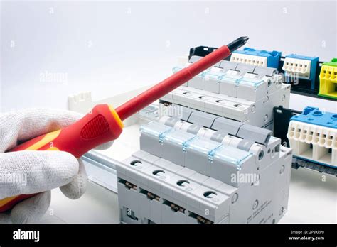 An Electrician Installs Fuses On The TH Rail In The Electrical Switchboard Stock Photo Alamy