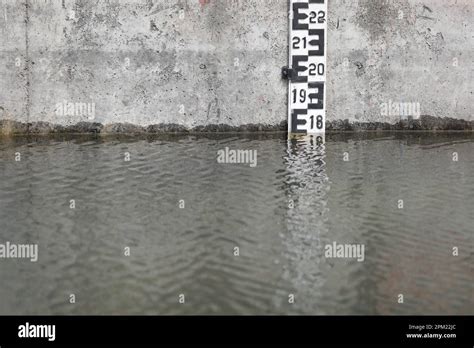 River Level Marker Near A Sluice On A Concrete Man Made River Stock Photo Alamy