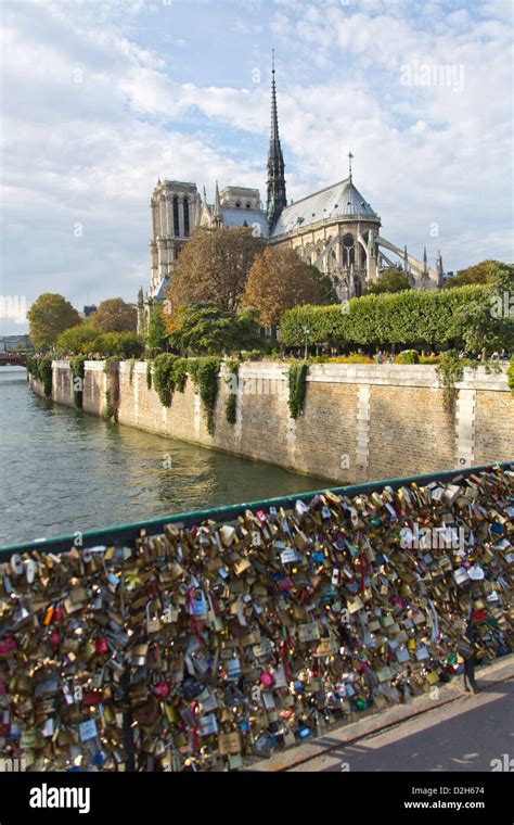 Notre Dame De Paris Cathedral With The River Seine Seen From Bridge