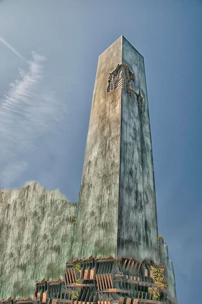 Premium Photo Metallic Monolite On Deep Blue Sky