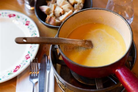 Fondue Savoyarde Heating In Caquelon On Table Stock Image Image Of
