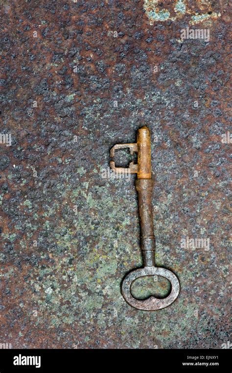 Old Key On A Rusty Metal Texture Background Stock Photo Alamy