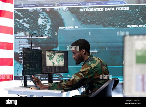 American Military Officer Works In A High Tech Command Post Managing National Safety Operations