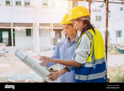 Engineer Women Builder Working At Construction Site Join Architect