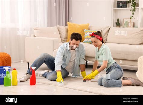 Spring Cleaning Couple Tidying Up Living Room Together Stock Photo Alamy