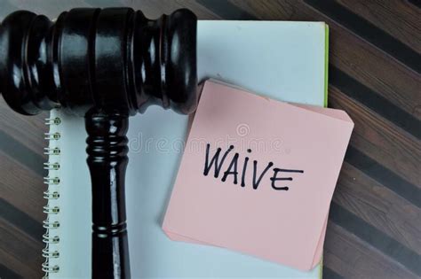 Concept Of Waive Write On Sticky Notes With Gavel Isolated On Wooden Table Stock Image Image
