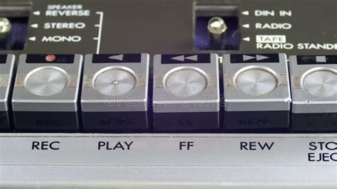 finger presses play stop and record control buttons on audio cassette player stock video