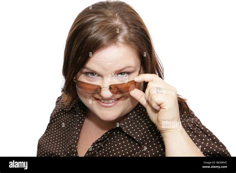 Pretty Plus Sized Model Wearing Stylish Sunglasses White Background