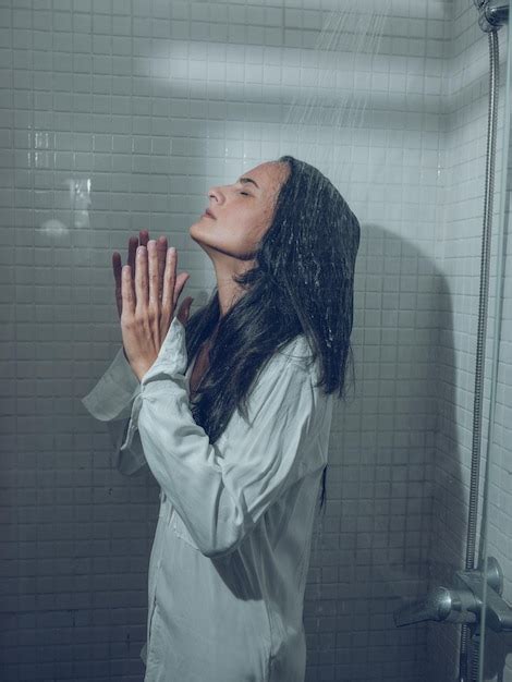 Premium Photo Hispanic Woman In Wet Shirt Relaxing Under Spraying Shower