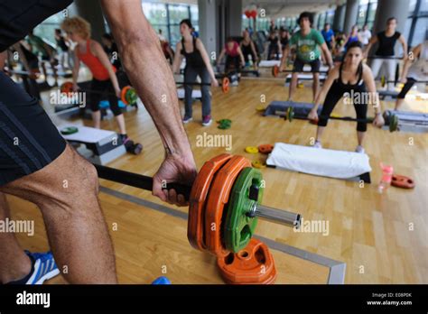 Fitness Instructors Hand And Barbell Detail During A Body Pump Class