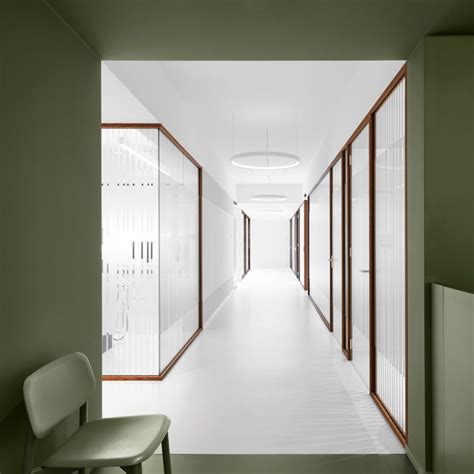 Impress Dental Clinic In Barcelona Features Smile Shaped Timber Partitions