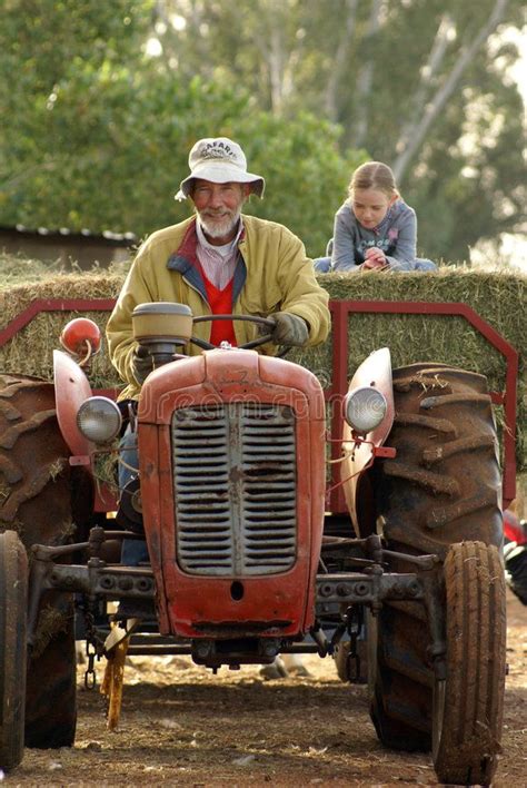 Grant Father Farmer Grant Father And Grant Daughter Driving On Tractor