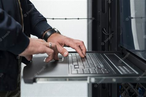 Premium Photo Close Up On Data Center Engineer Hands Using Keyboard