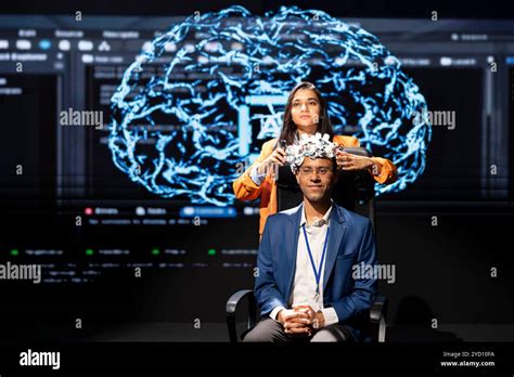 Experts Speaking At Tech Event Explaining Impact Of Neural Implants And Artificial Intelligence