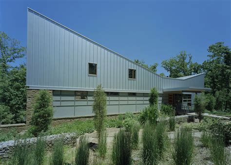 Bowtie House By Demx Architecture Has An Angular Metal Roof