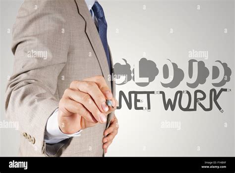 Businessman Hand Drawing Cloud Network Desogn Word And Diagram On The