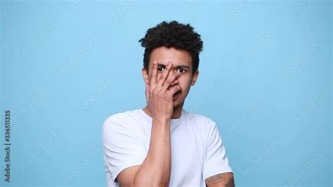 Scared Shocked African American Young Guy 20s In White T Shirt Posing
