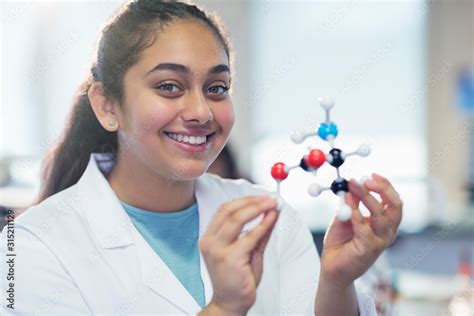 Portrait Smiling Girl Babe Holding Molecular Model In Laboratory Classroom Stock Photo