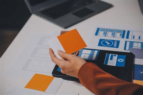 Premium Photo Team Of Ui Ux Web Designer Are Working Together To Develop Mobile Responsive