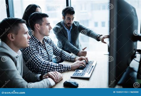 software engineers working in office on project together stock image