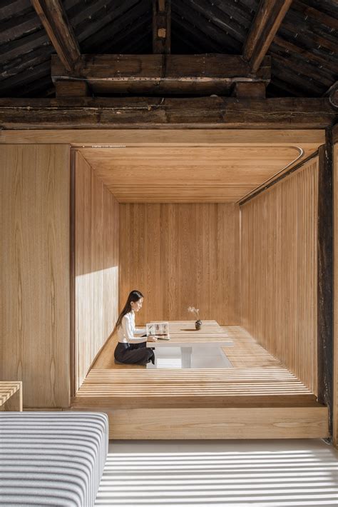 Undulating Paving Connects Inside And Outside Spaces At Twisting Courtyard House