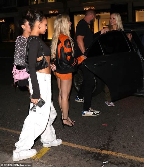 Lottie Moss Puts On A Very Leggy Display In An Orange Mini Dress