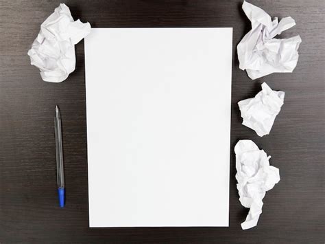 Premium Photo Empty Paper Crumpled Paper And Pen On Wooden Table