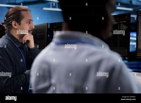 It Engineers In Data Center Facility Using Diagnostic Tools And System Monitoring Software To