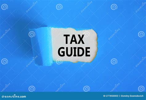 Tax Guide Symbol Concept Words Tax Guide On Beautiful White Paper Beautiful Blue Table Blue