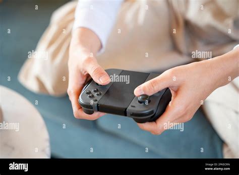 Woman Holding A Game Controller Stock Photo Alamy