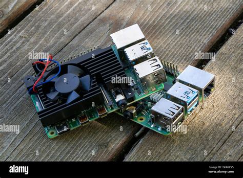 a raspberry pi microcomputer 4b with a black heatsink for electrical