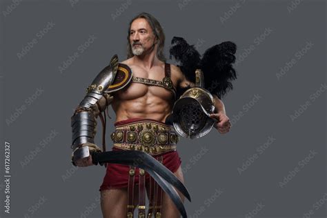 Imposing Gladiator Of Mature Age With A Stylish Silver Beard And Flowing Grey Hair Dons