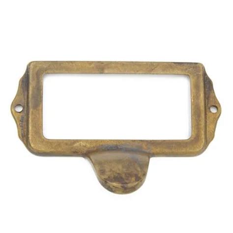 An Old Brass Plate With A Hole In The Middle