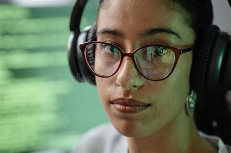 Portrait Of Middle Eastern Female Coder In Headphones And Glasses