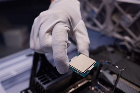 Premium Photo Cropped Image Of An Engineer Showing A Computer Microchip On The Foreground