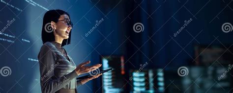 Asian Woman Programmer Standing In Front Of A Screen With Code