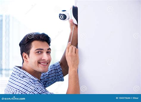 The Man Installing Surveillance Cctv Cameras At Home Stock Photo Image Of Fitting Monitoring