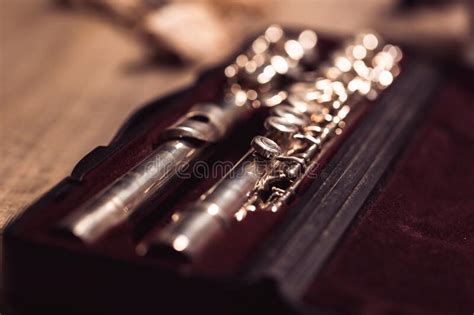 A Portrait Of A Valve Of A Disassembled Metal Silver Flute In A Case