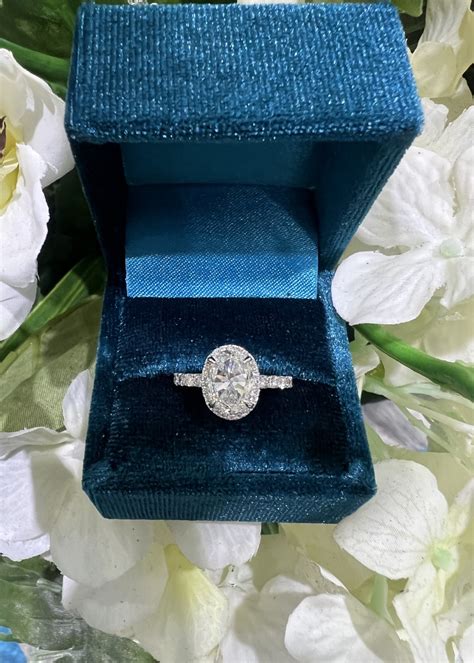 14kw 54ctw Tiny Halo Featuring 2ct Naturally Mined Oval Cut Hsi1