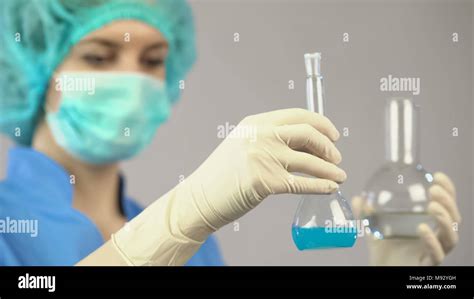 Female Chemist Holding Tubes With Liquid Working In Laboratory On Vaccine Stock Photo Alamy