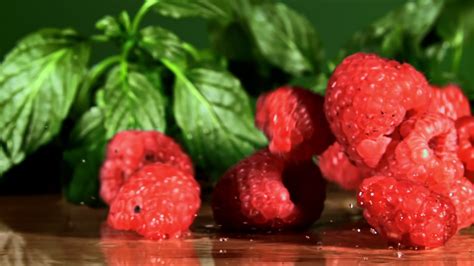 Raspberries Fall On A Wet Table Filmed Is Slow Motion 1000 Fps High Quality Fullhd Footage