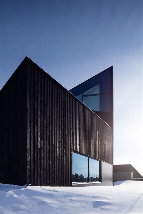 Shape Architecture Tops Centre For Remembrance With Angular Tower