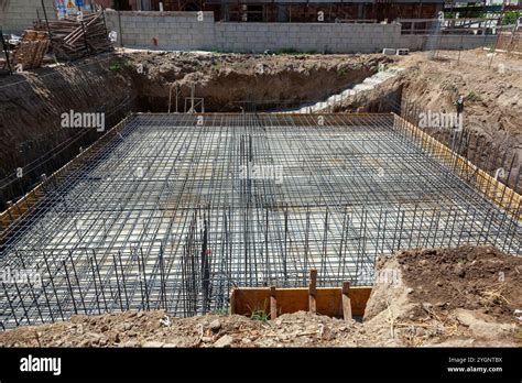 Foundation Reinforcement With Steel Rebar Grid Preparing For Concrete Pouring At Building