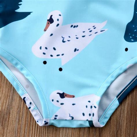 ชุดว่ายน้ำลายหงส์สำหรับเด็กผู้หญิง ชุดว่ายน้ำโชว์หลังชุดบิกินี่แบบวันพีซใส่เดินชายหาดสำหรับเด็ก