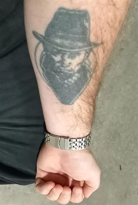 Anton Lavey Tattoo Depicting Him From A Drawing By Nick Bougas For An